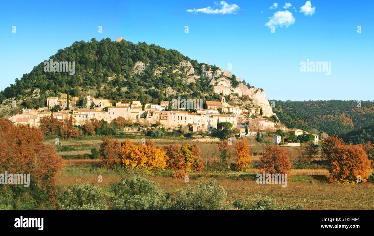 The village of Séguret among the vines in the colors of autumn ...