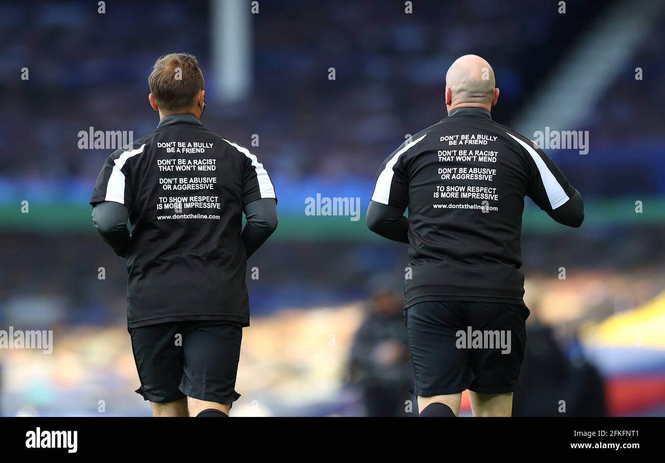 Match officials wear an anti racism and bullying t-shirt in the warm up ...