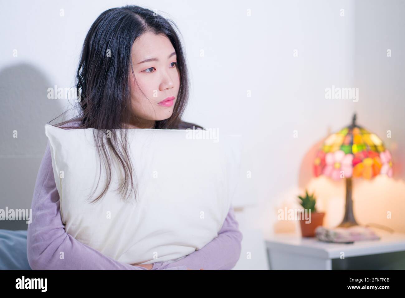 young Asian woman depressed - young beautiful and sad Chinese girl on ...