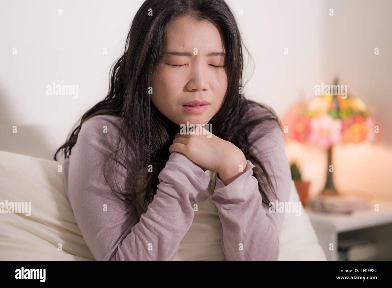 young Asian woman depressed - young beautiful and sad Chinese girl on ...