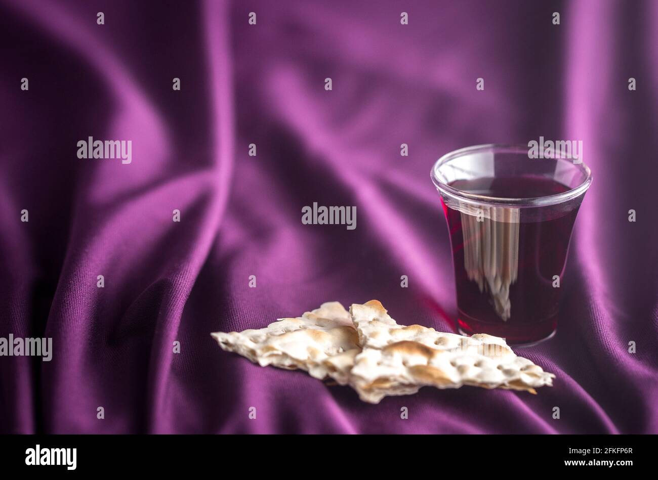 Christian Communion on a Purple Fabic Background Stock Photo - Alamy