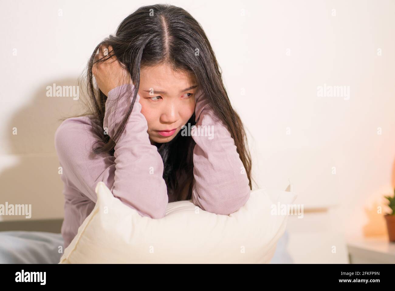 young Asian woman depressed - young beautiful and sad Korean girl on ...