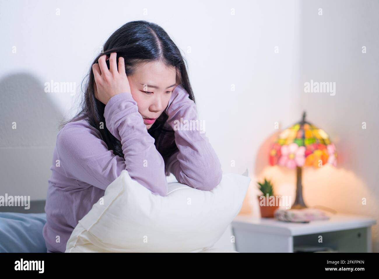 young Asian woman depressed - young beautiful and sad Japanese girl on ...