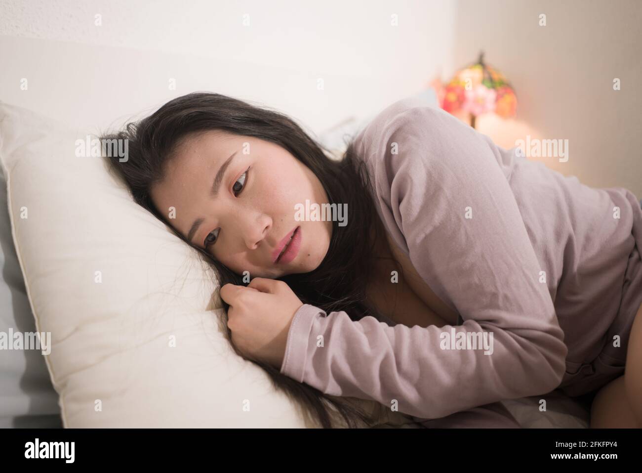 young Asian woman depressed - young beautiful and sad Japanese girl on ...