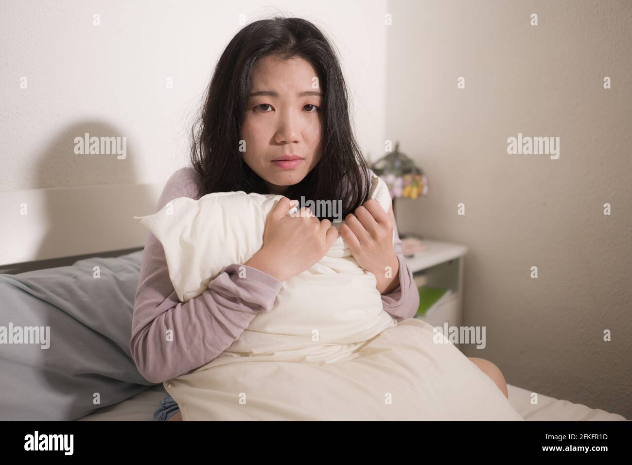 young Asian woman depressed - young beautiful and sad Japanese girl on ...