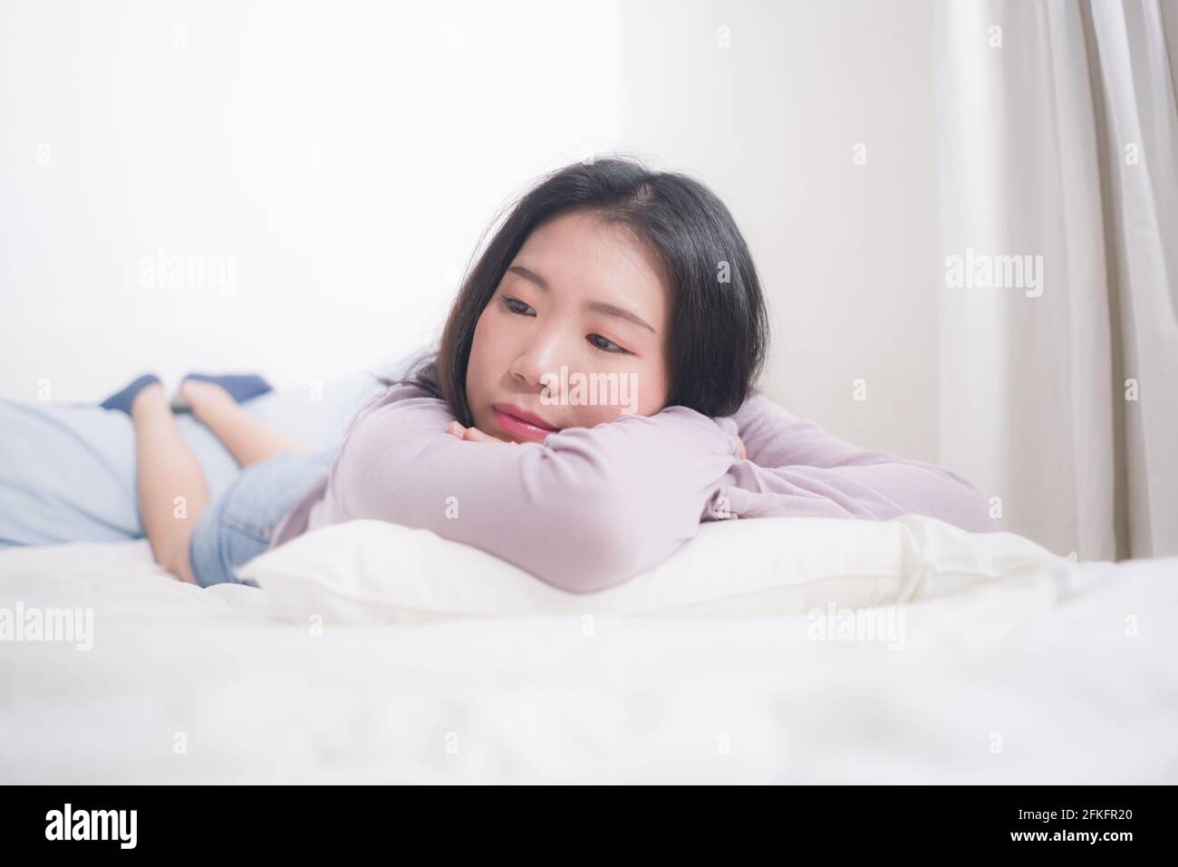 young Asian woman depressed - young beautiful and sad Japanese girl on ...