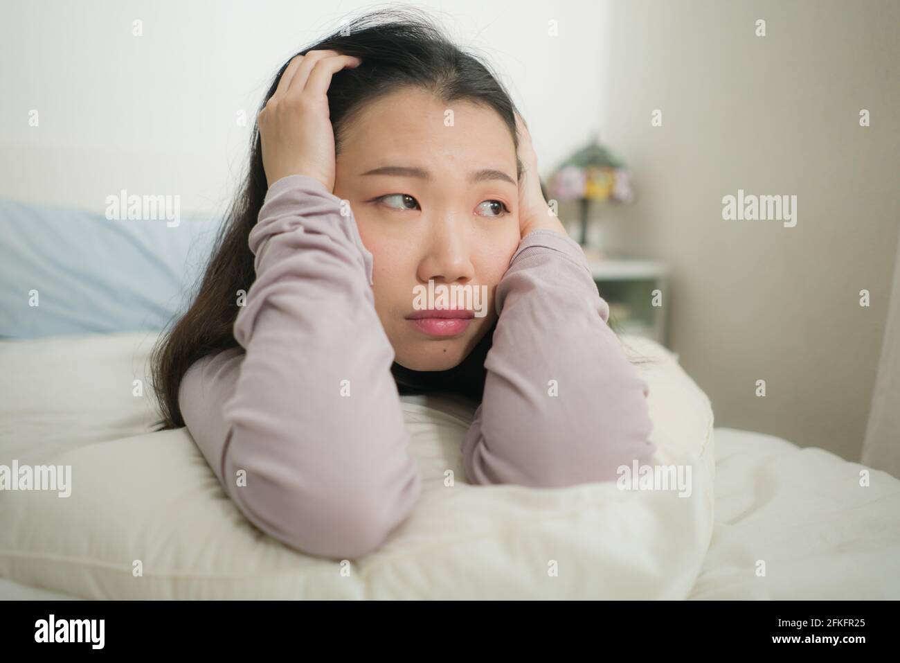 young Asian woman depressed - young beautiful and sad Japanese girl on ...