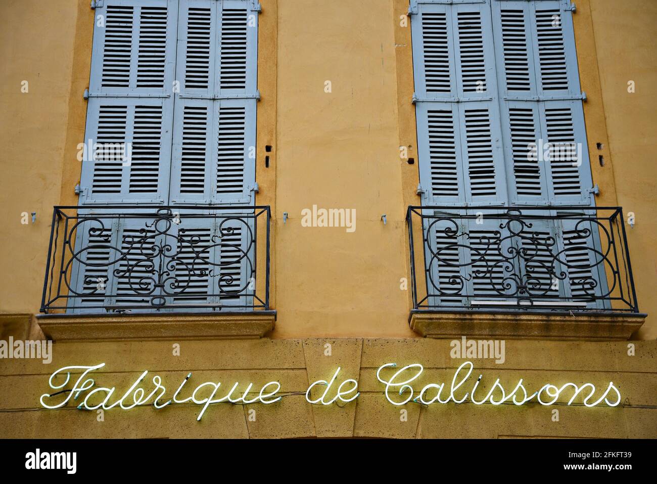 Local artisan Calissons factory facade with ochre walls and the ...