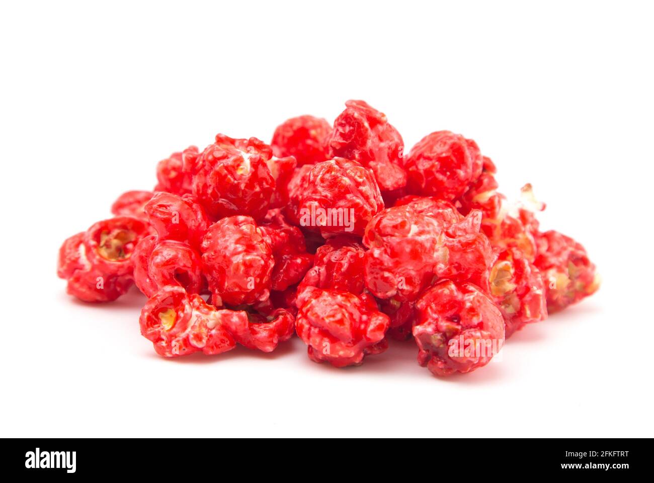 Red Colored Candy Coated Popcorn on a White Background Stock Photo - Alamy