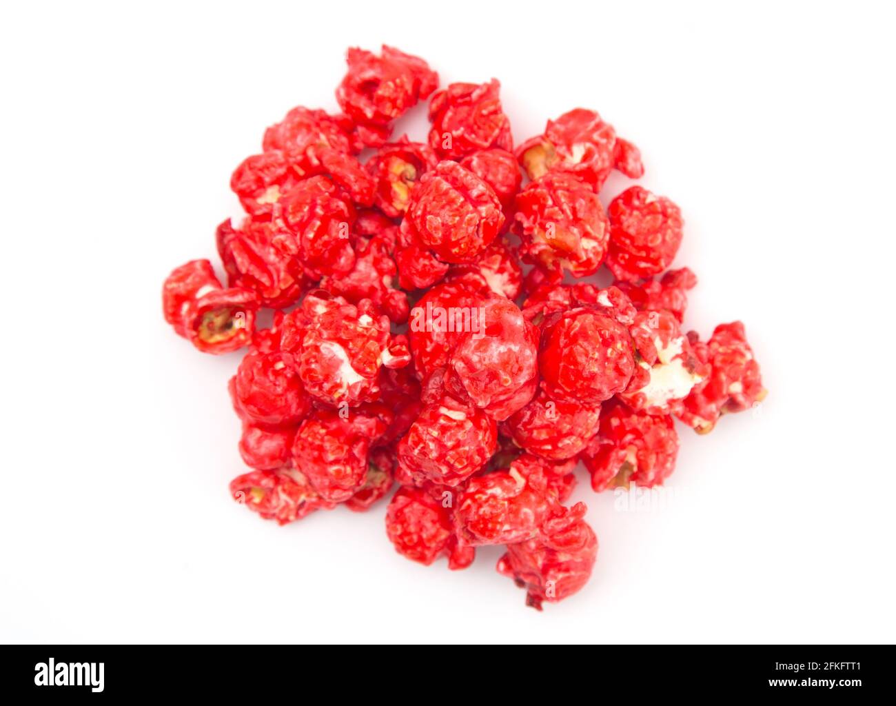 Red Colored Candy Coated Popcorn on a White Background Stock Photo - Alamy