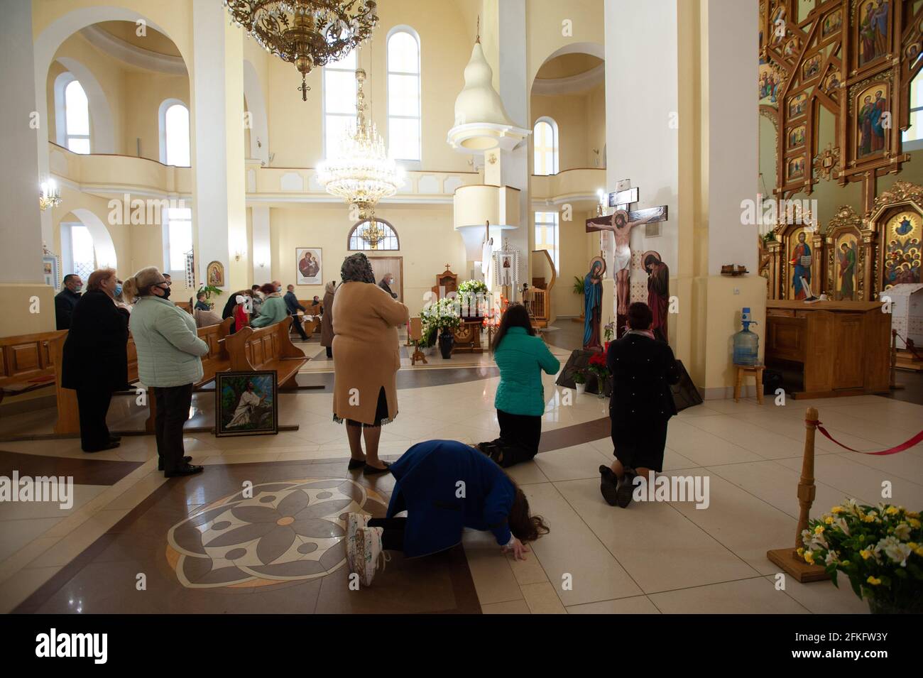 Believers in line to pray to the Epitaphios in the Greek Catholic ...