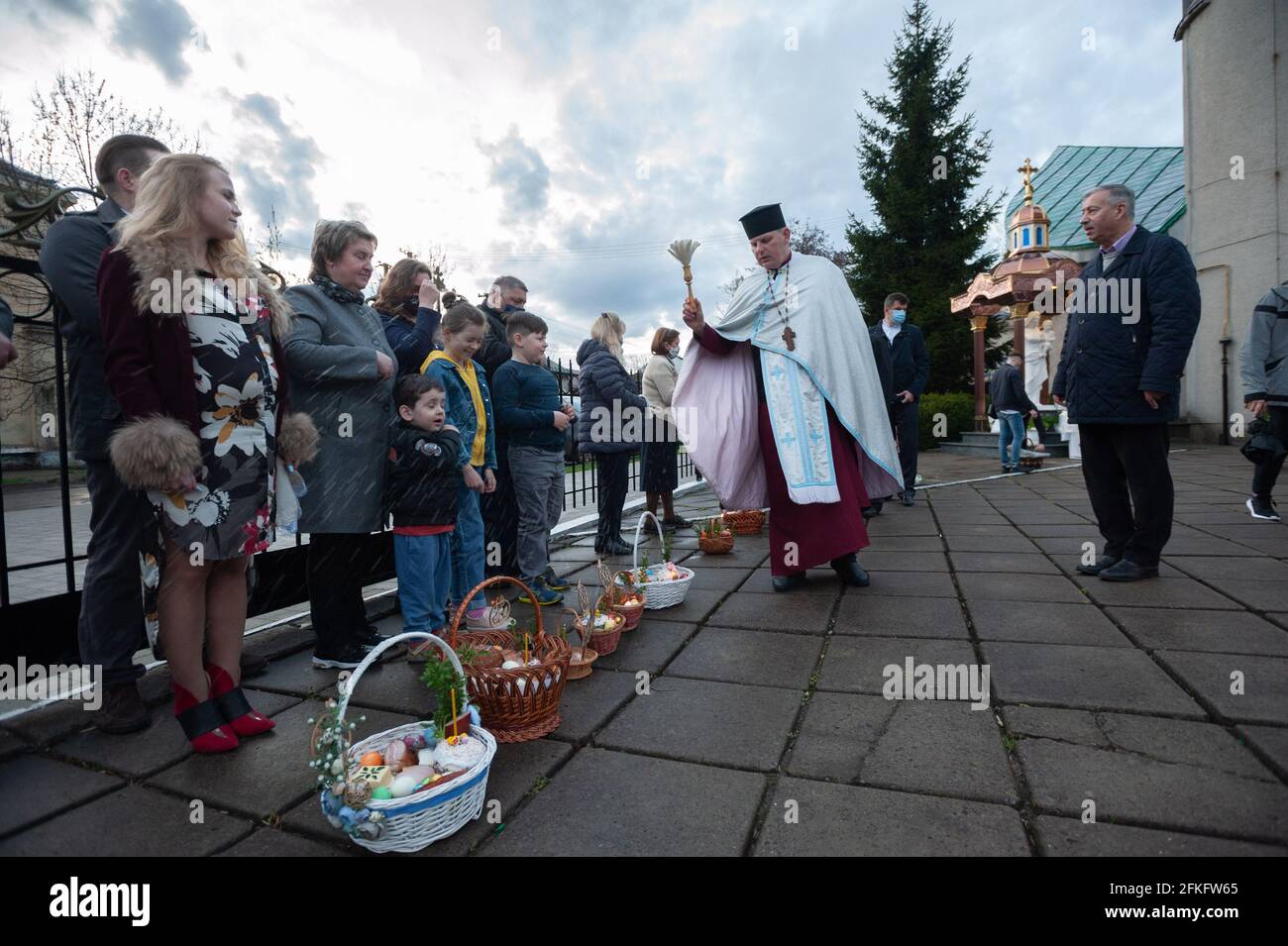 A Ukrainian priest blesses believers near Orthodox Church. Christians ...