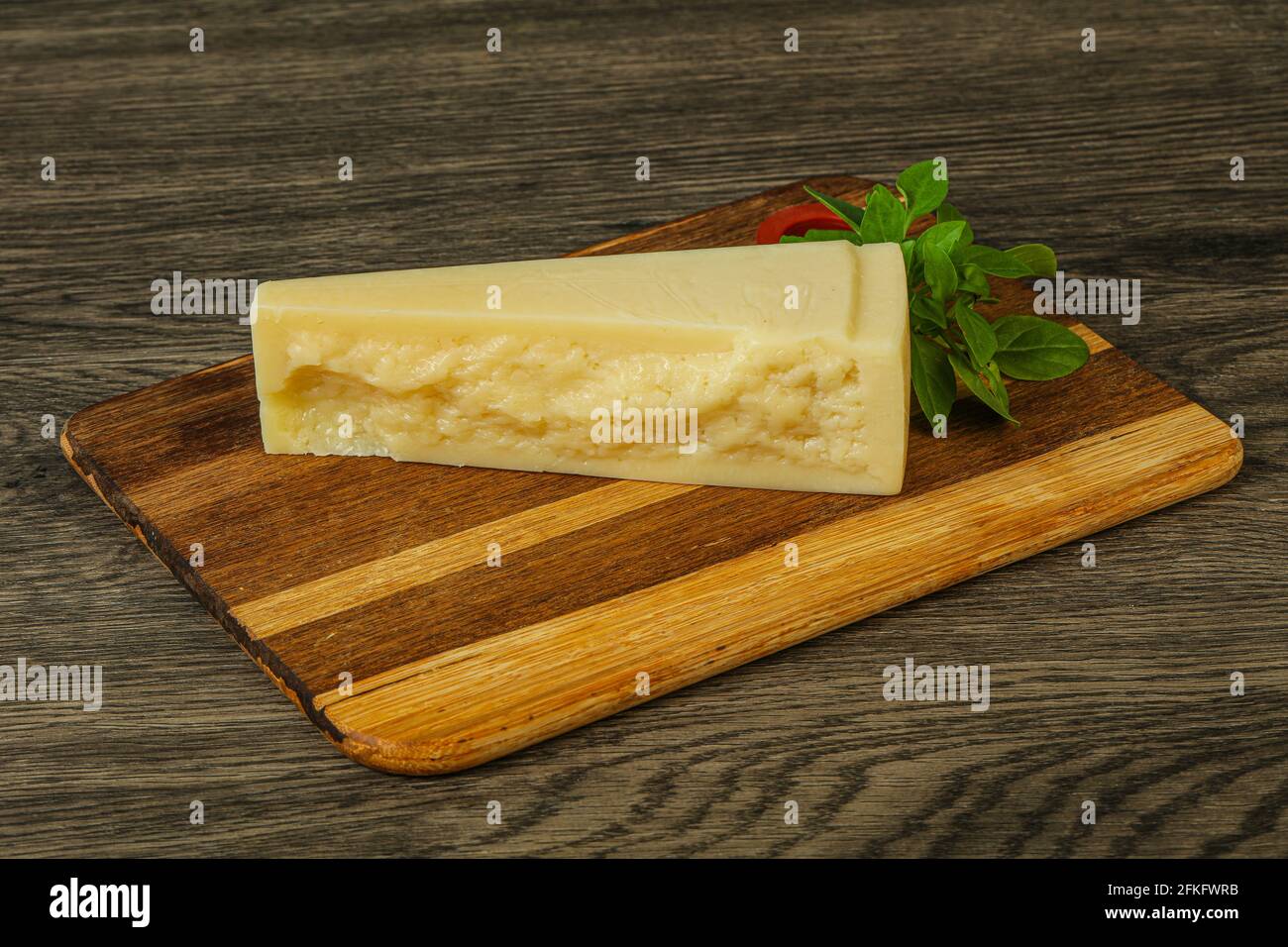 Hard parmesan cheese served basil leaves Stock Photo - Alamy