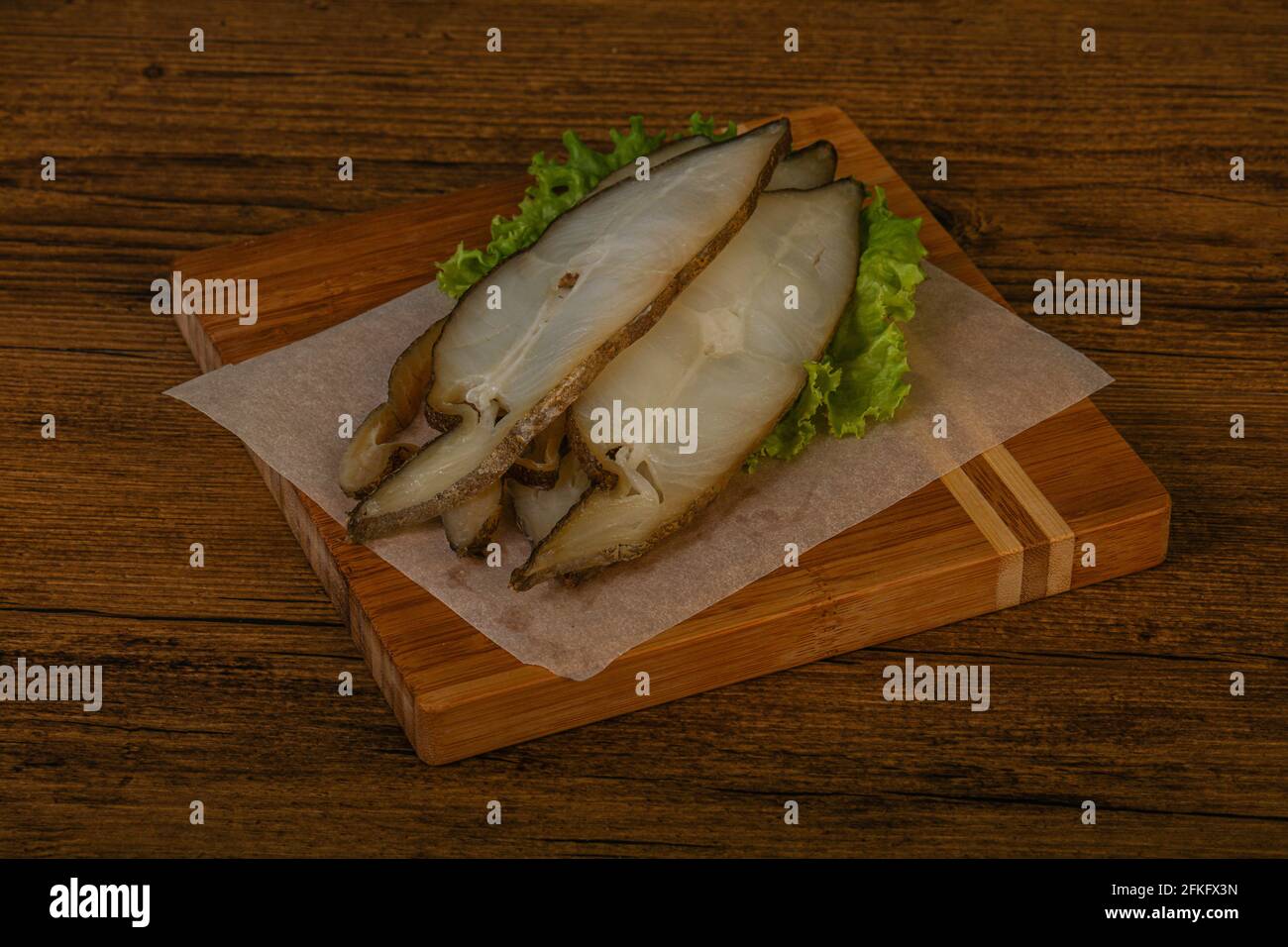 Delicous smoked halibut fish slices snack Stock Photo - Alamy