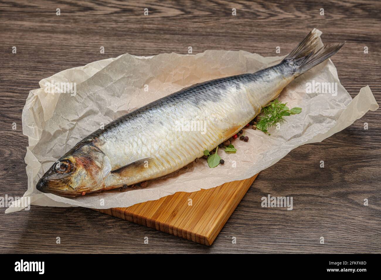 Salted Herring fish with pepper and spices Stock Photo - Alamy