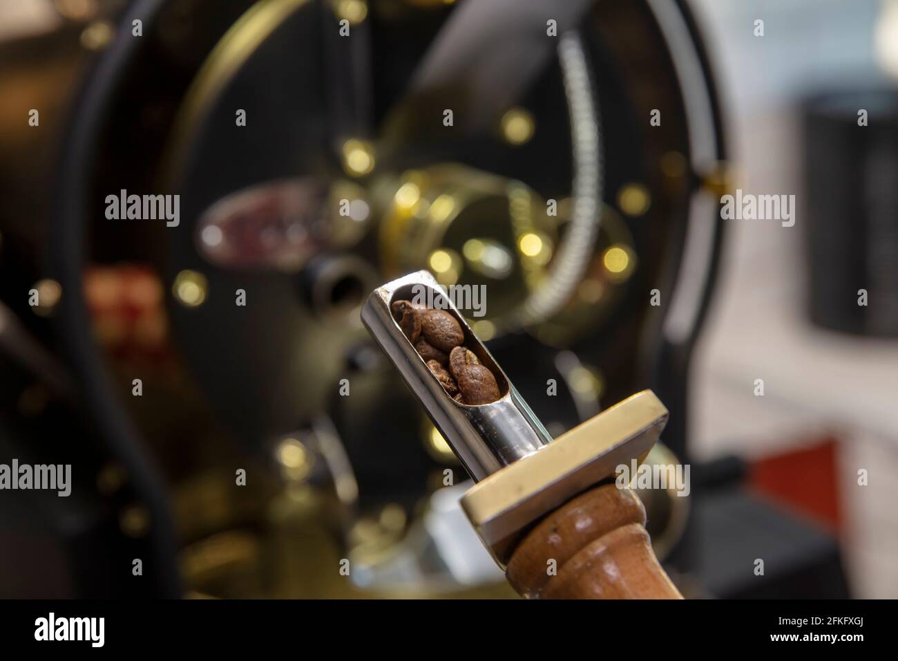 Coffee Roaster. Roasting coffee beans hand close up. Top view near ...