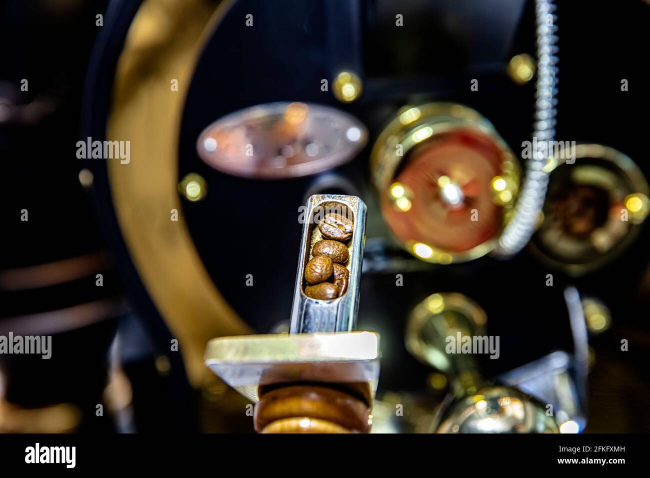 Coffee Roaster. Roasting coffee beans hand close up. Top view near ...