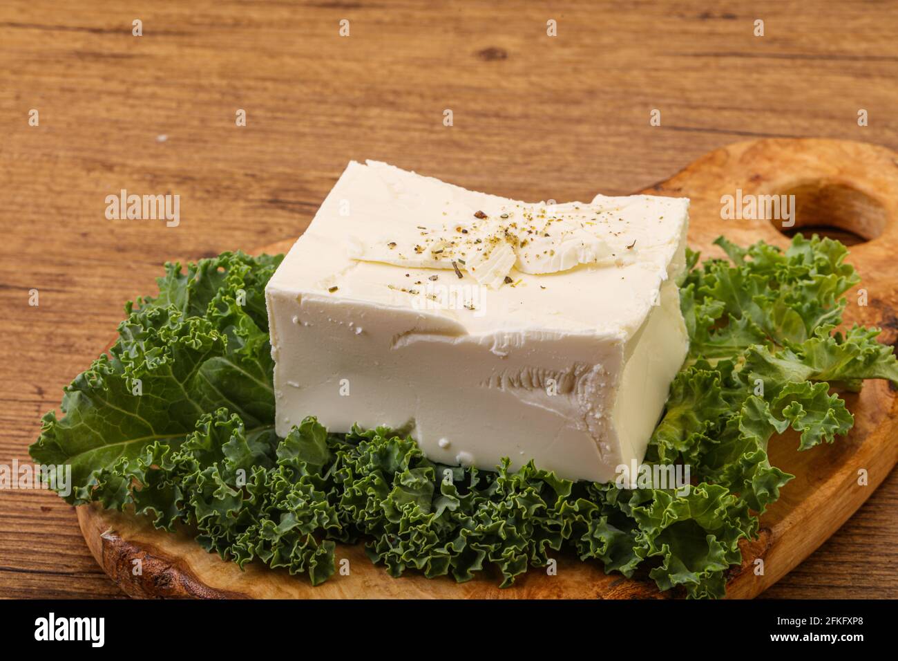Traditional tasty Greek Feta soft cheese brick Stock Photo - Alamy
