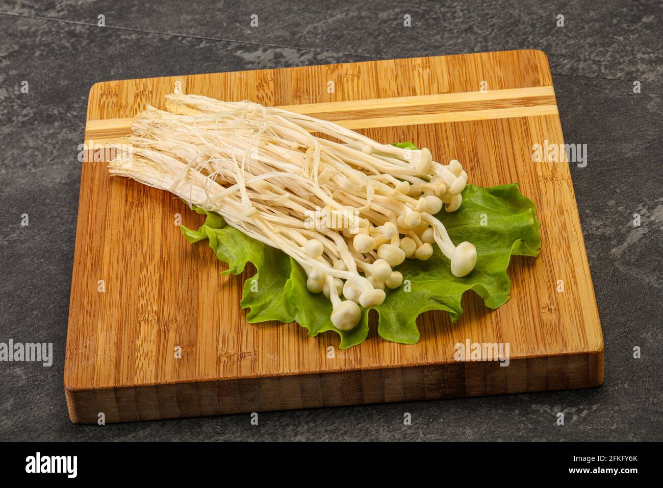 Raw Japanese Enoki mushrooms for cooking Stock Photo - Alamy