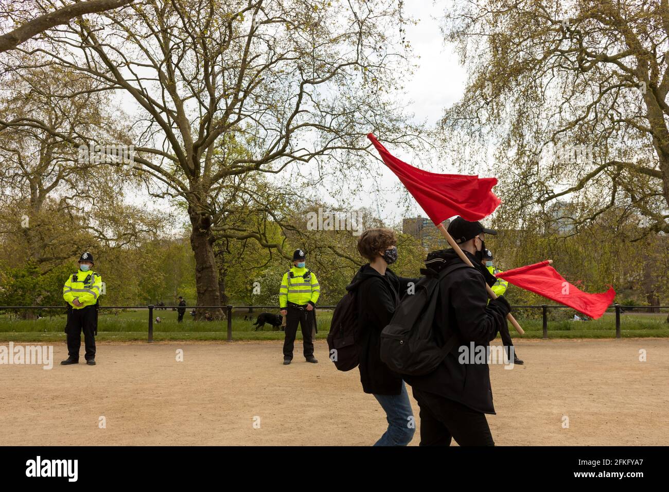 London, UK. 01st May, 2021. Protestors waving red flags in St. James's ...
