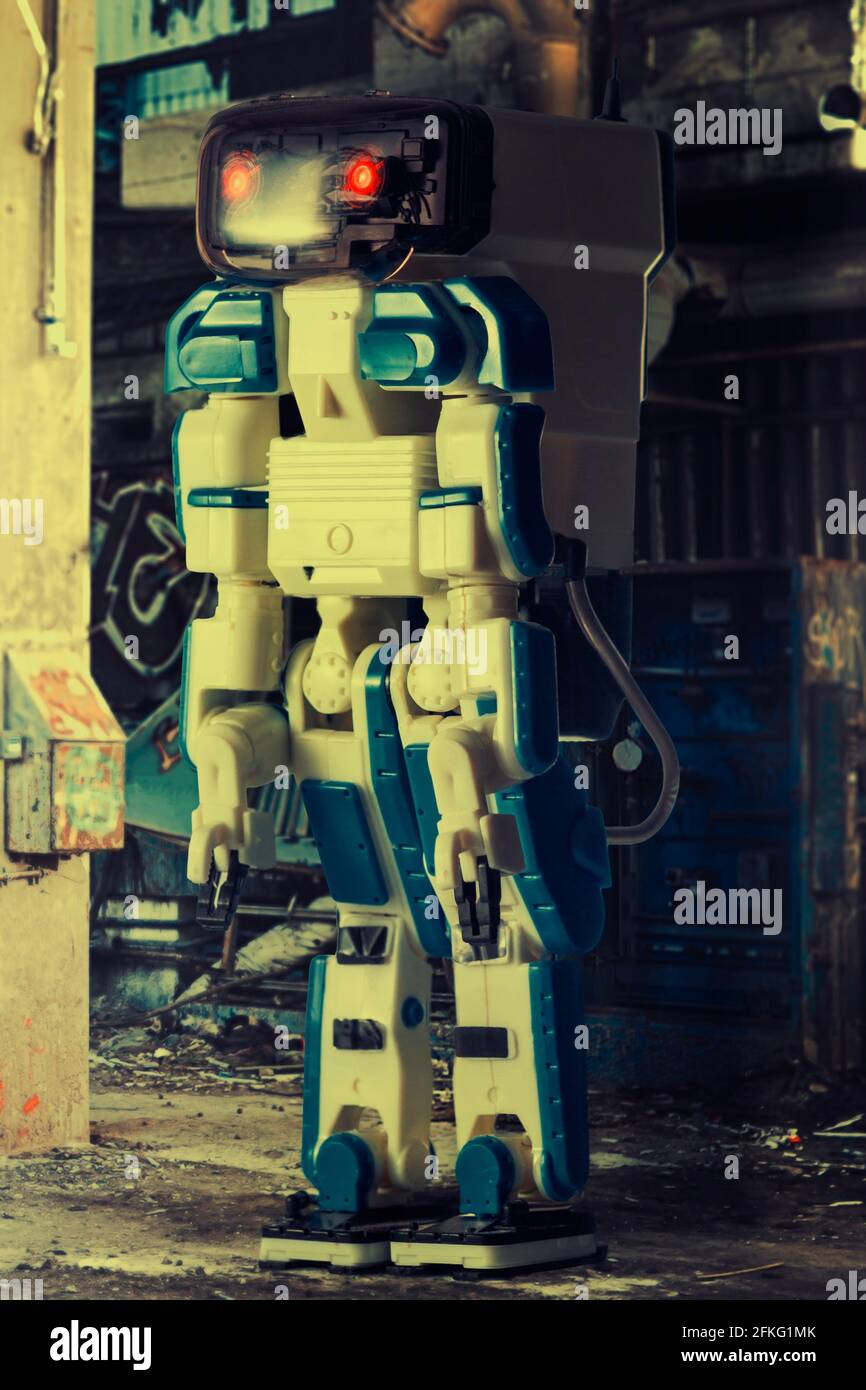 Modern advanced autonomous robot toy isolated on a industrial ...