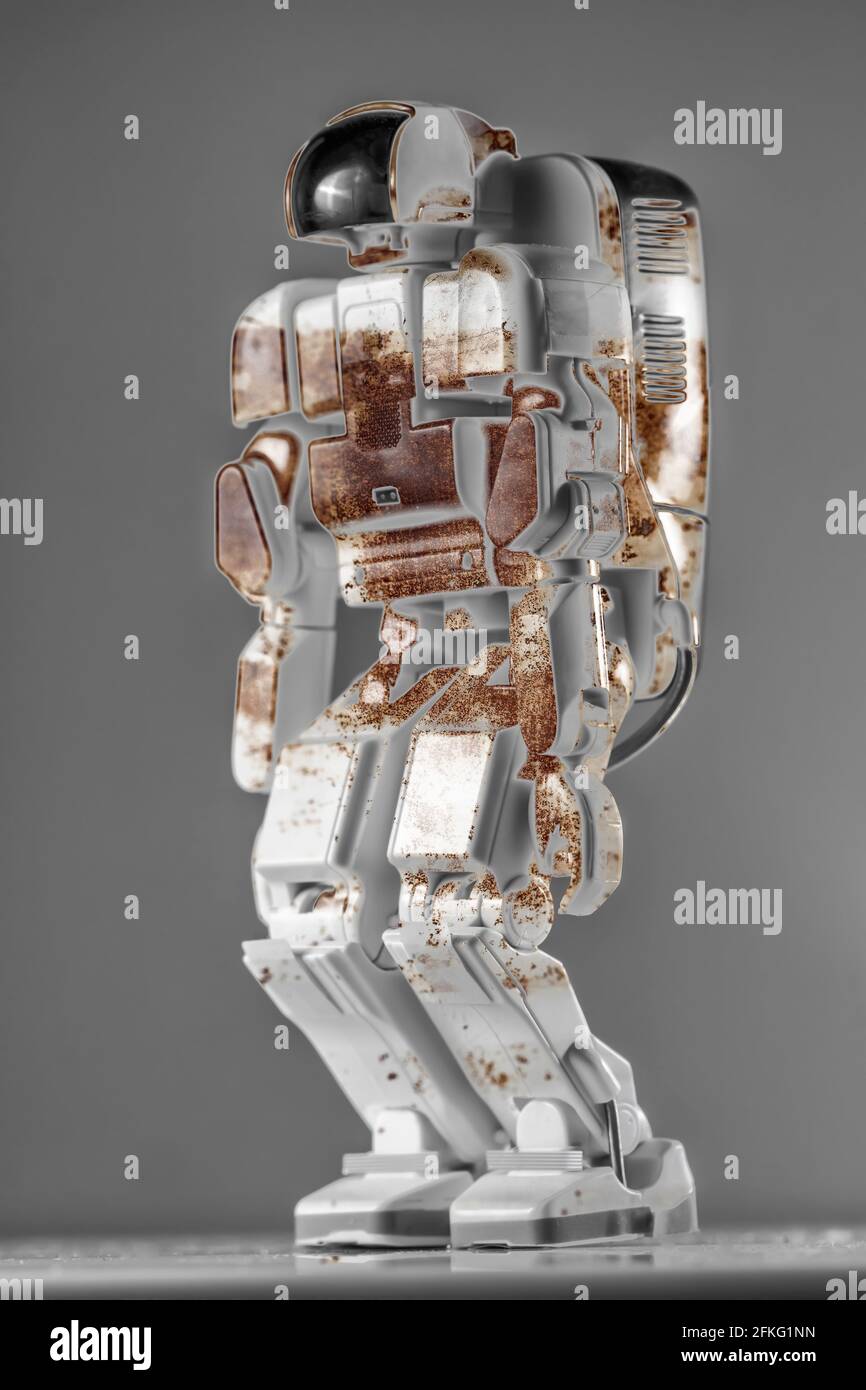 Modern advanced autonomous robot toy with rust effects isolated on a ...