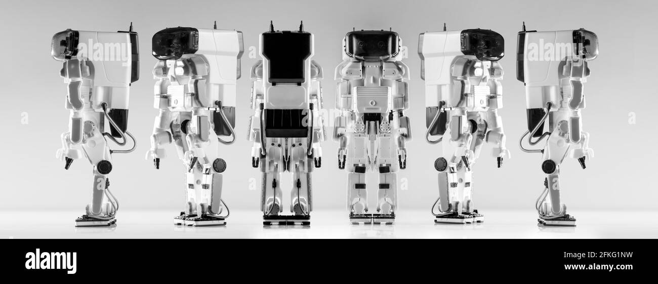 Modern advanced autonomous robot toy isolated on a gray background ...