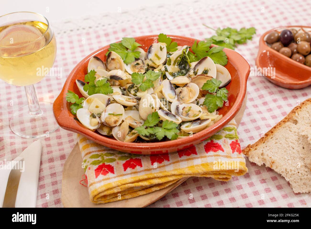Typical starter portuguese meal of clams with garlic, olive oil and ...