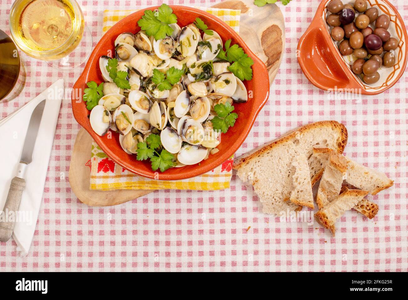 Typical starter portuguese meal of clams with garlic, olive oil and ...