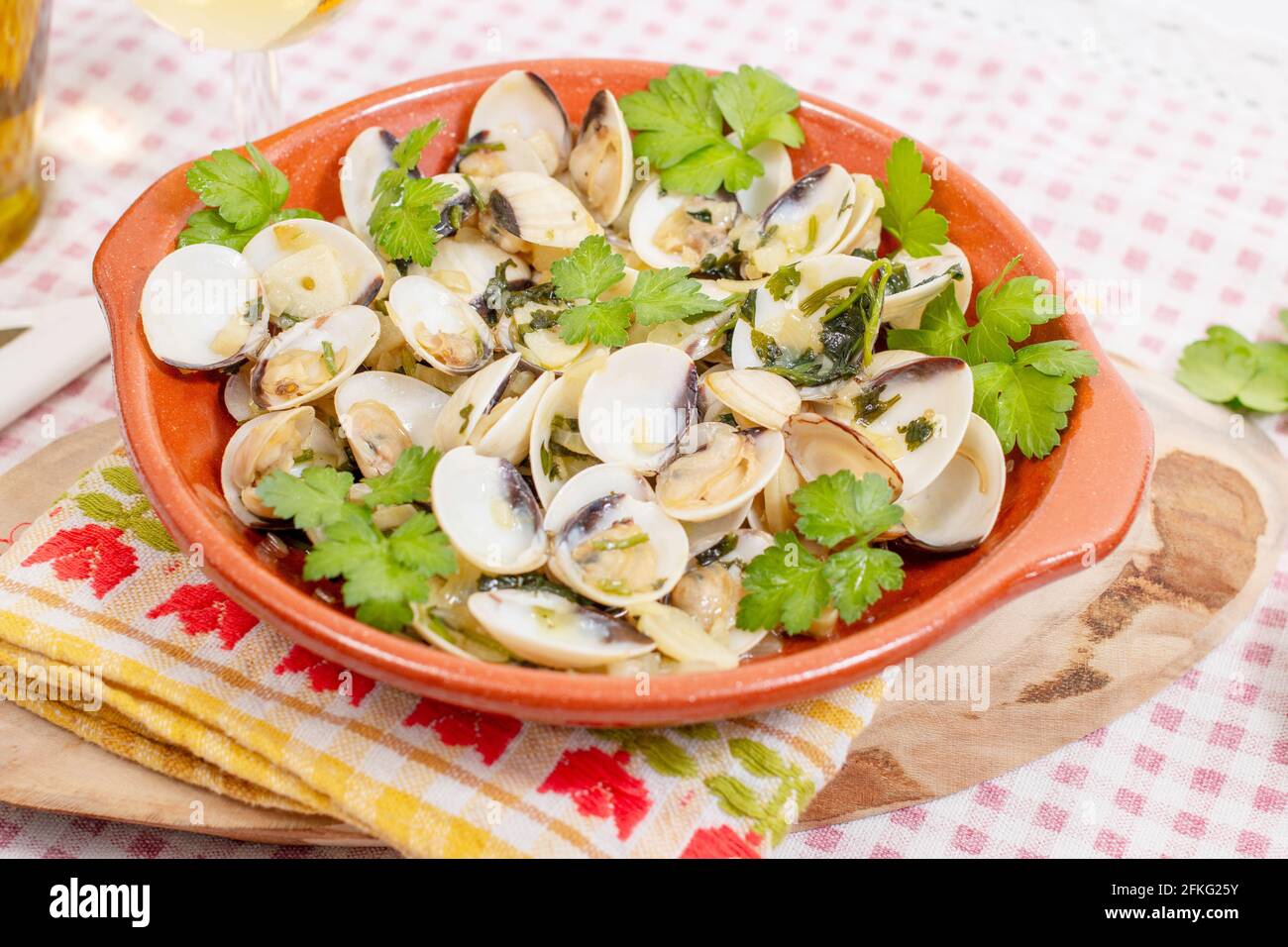 Typical starter portuguese meal of clams with garlic, olive oil and ...
