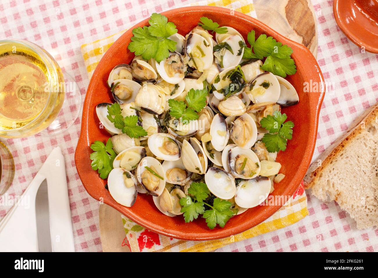 Typical starter portuguese meal of clams with garlic, olive oil and ...