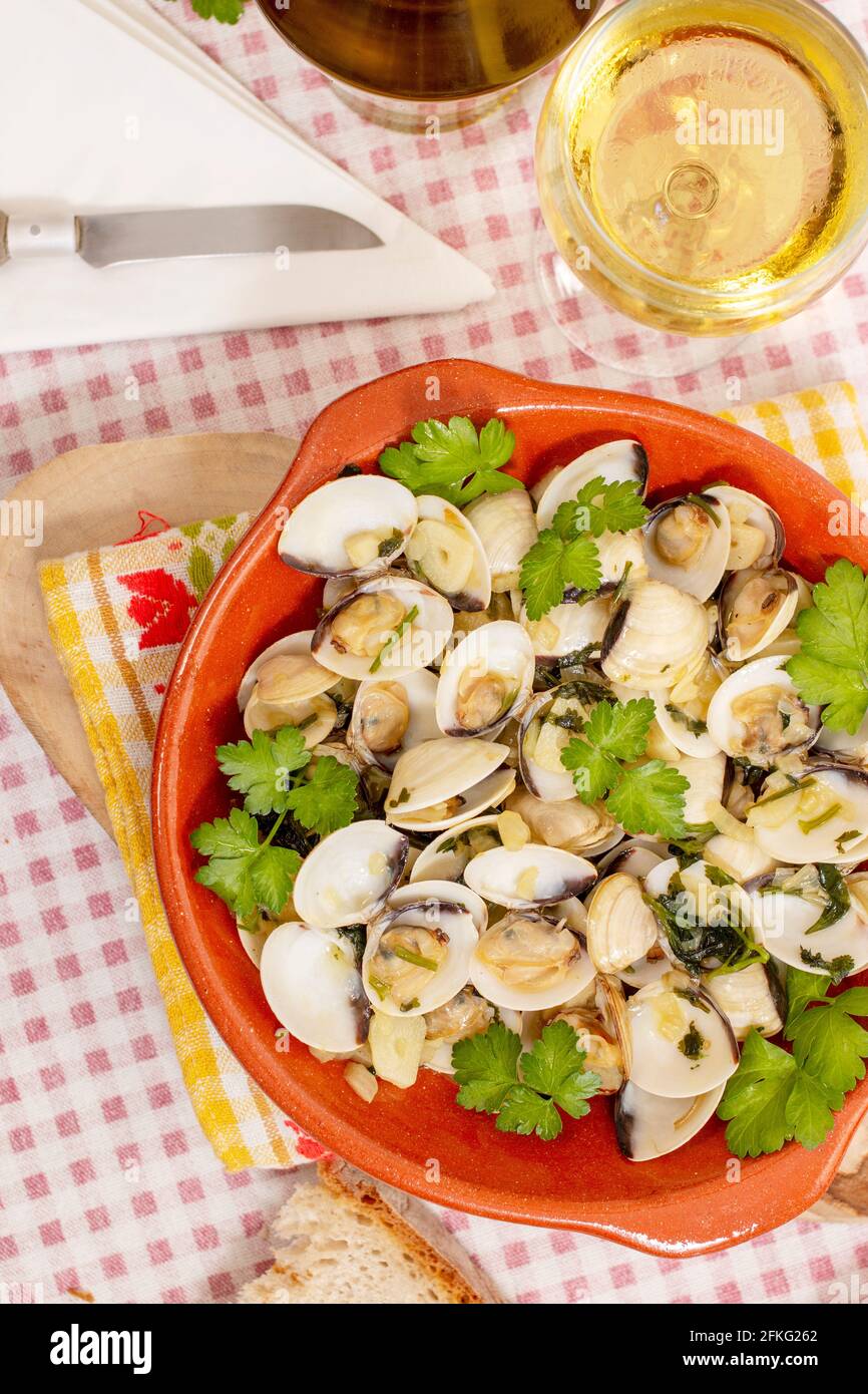 Typical starter portuguese meal of clams with garlic, olive oil and ...