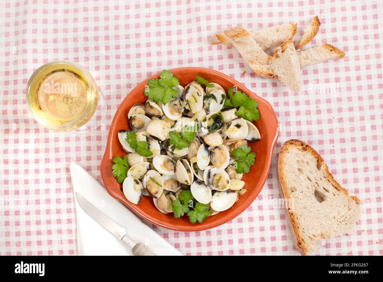 Typical starter portuguese meal of clams with garlic, olive oil and ...