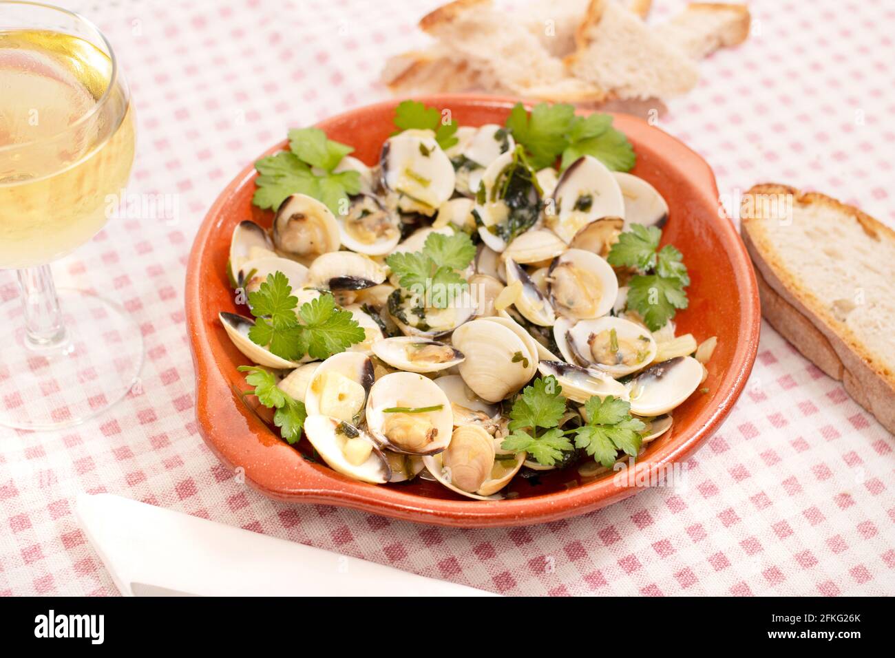 Typical starter portuguese meal of clams with garlic, olive oil and ...