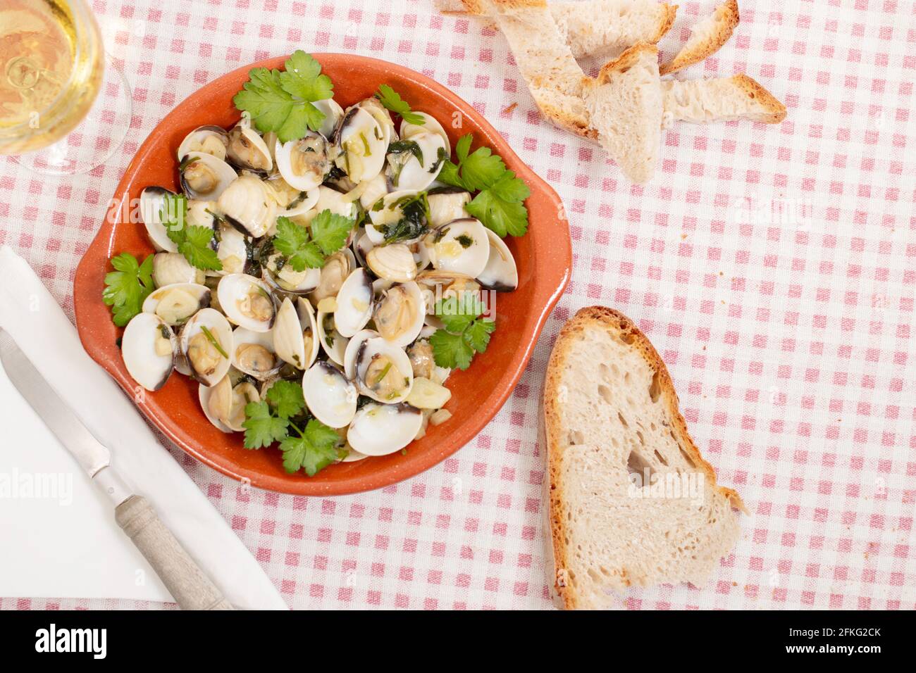 Typical starter portuguese meal of clams with garlic, olive oil and ...