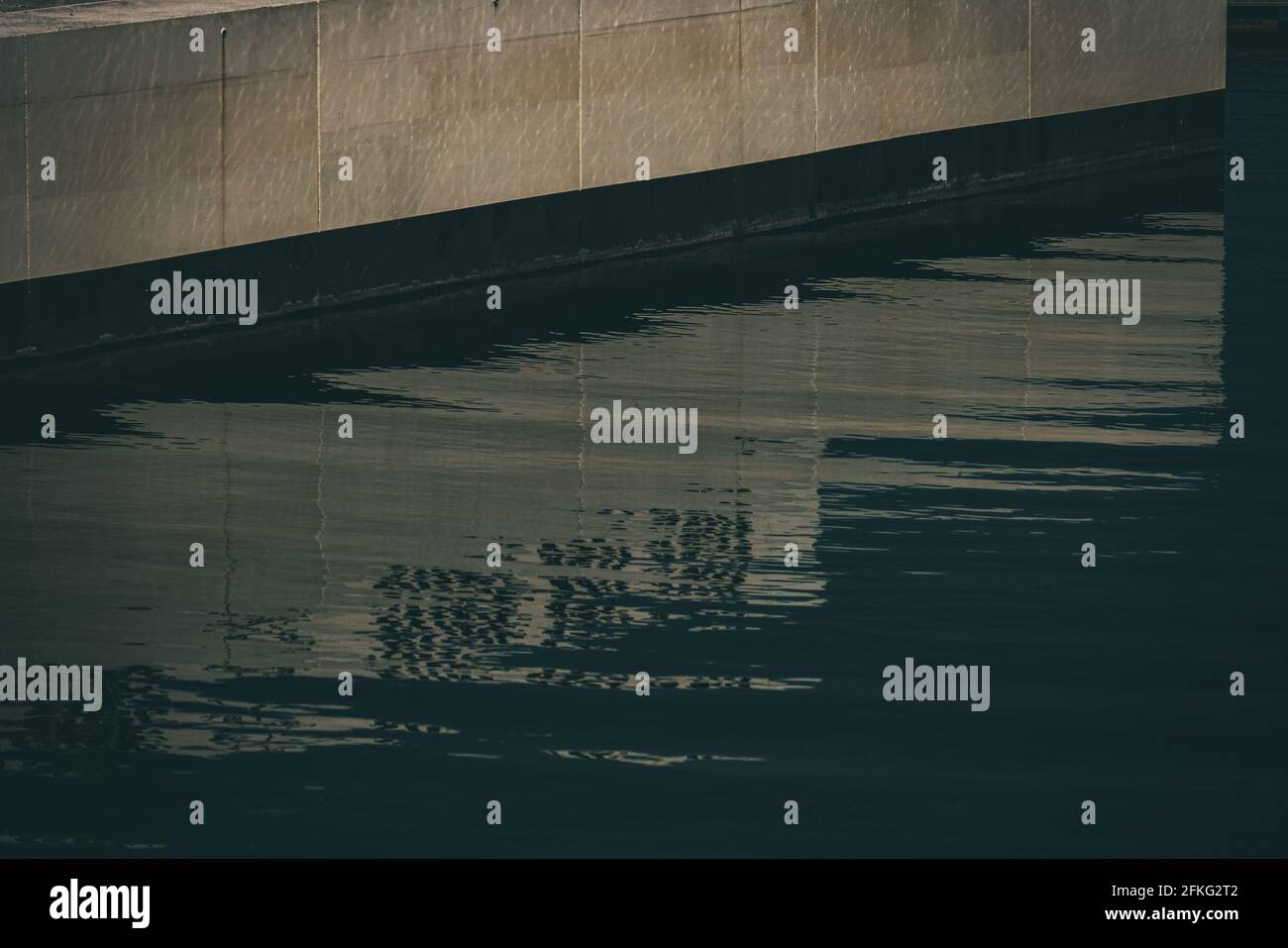 Reflection of light on water near a tiled wall outdoors Stock Photo - Alamy