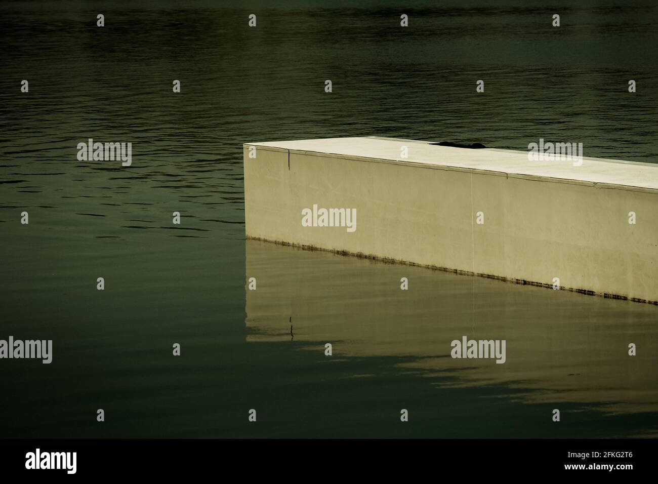 Reflection of light on water near a tiled wall outdoors Stock Photo - Alamy
