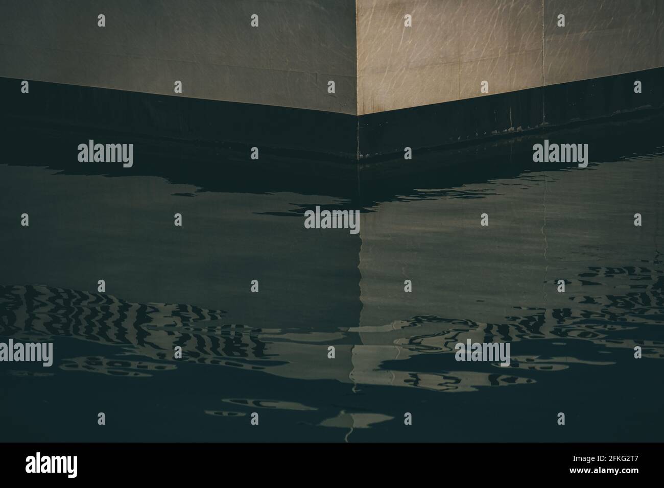 Reflection of light on water near a tiled wall outdoors Stock Photo - Alamy