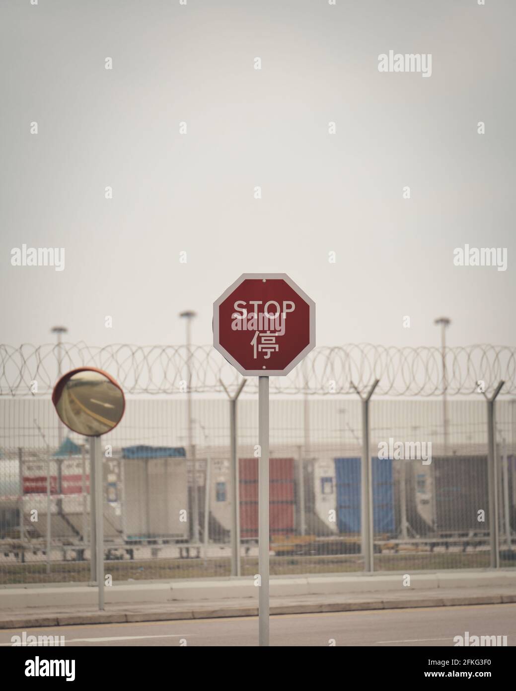 Red stop sign against barbed wire Stock Photo - Alamy