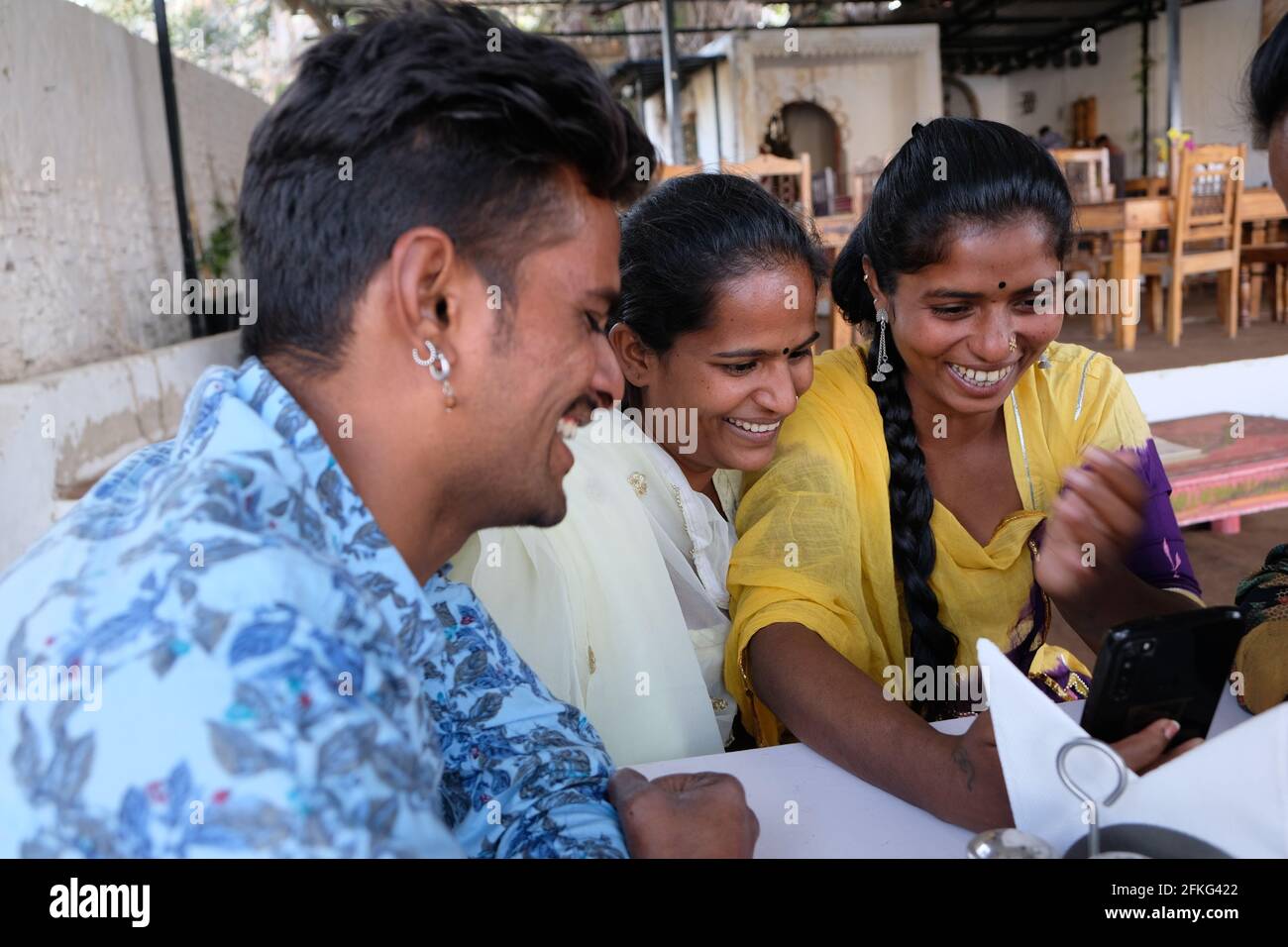 Group of happy young Indian friends having fun in a cafe Stock Photo ...