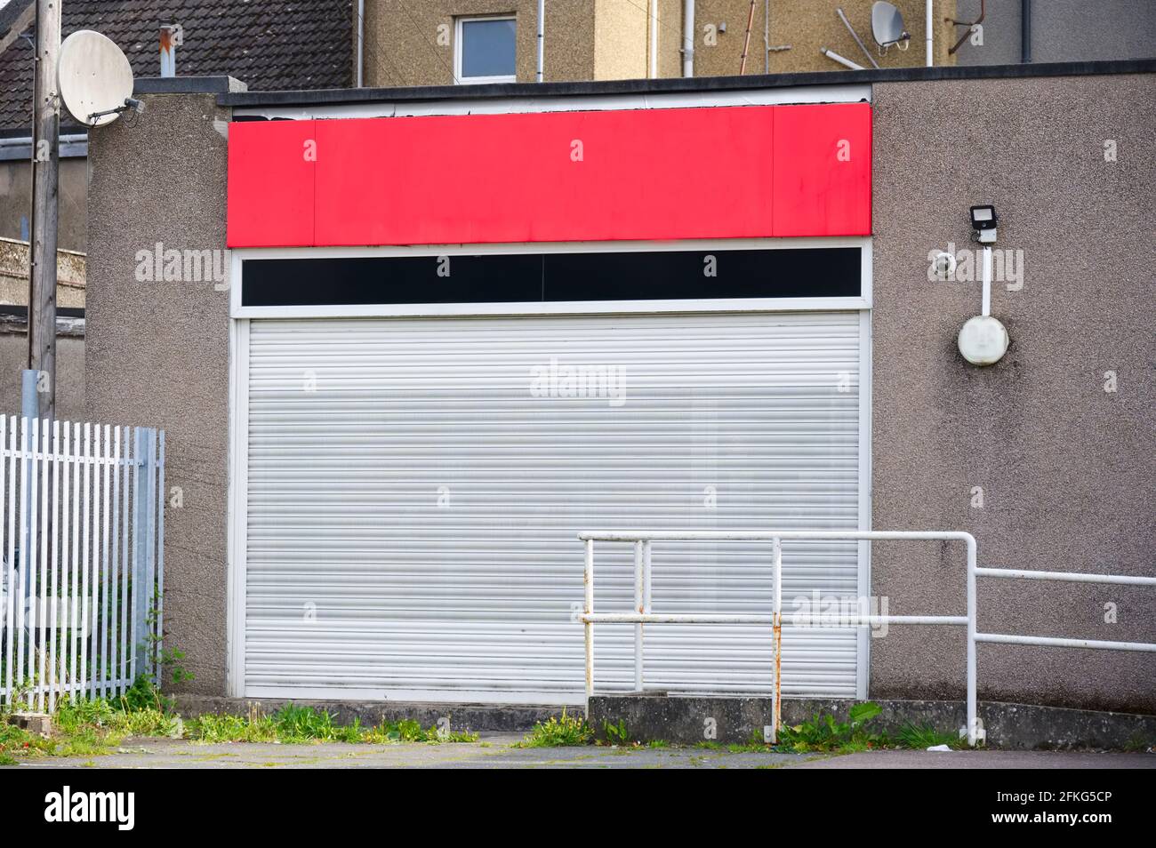 Shop front with blank sign and closed shutter door Stock Photo - Alamy