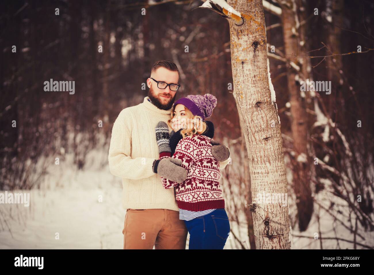 Outdoor happy couple in love posing in cold winter weather Stock Photo ...