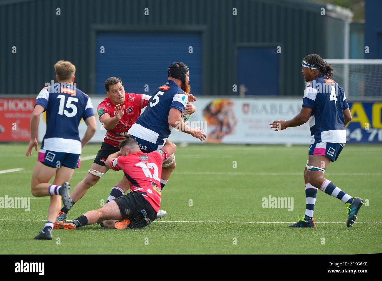Coventry, ENGLAND 1-MAY-2021:ALEX WOOLFORD of Coventry Rugby tackled by ...