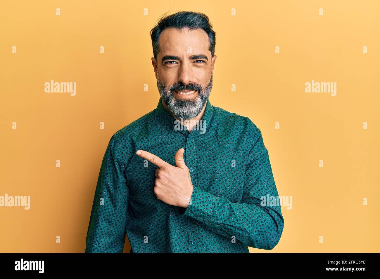 Middle age man with beard and grey hair wearing business clothes ...