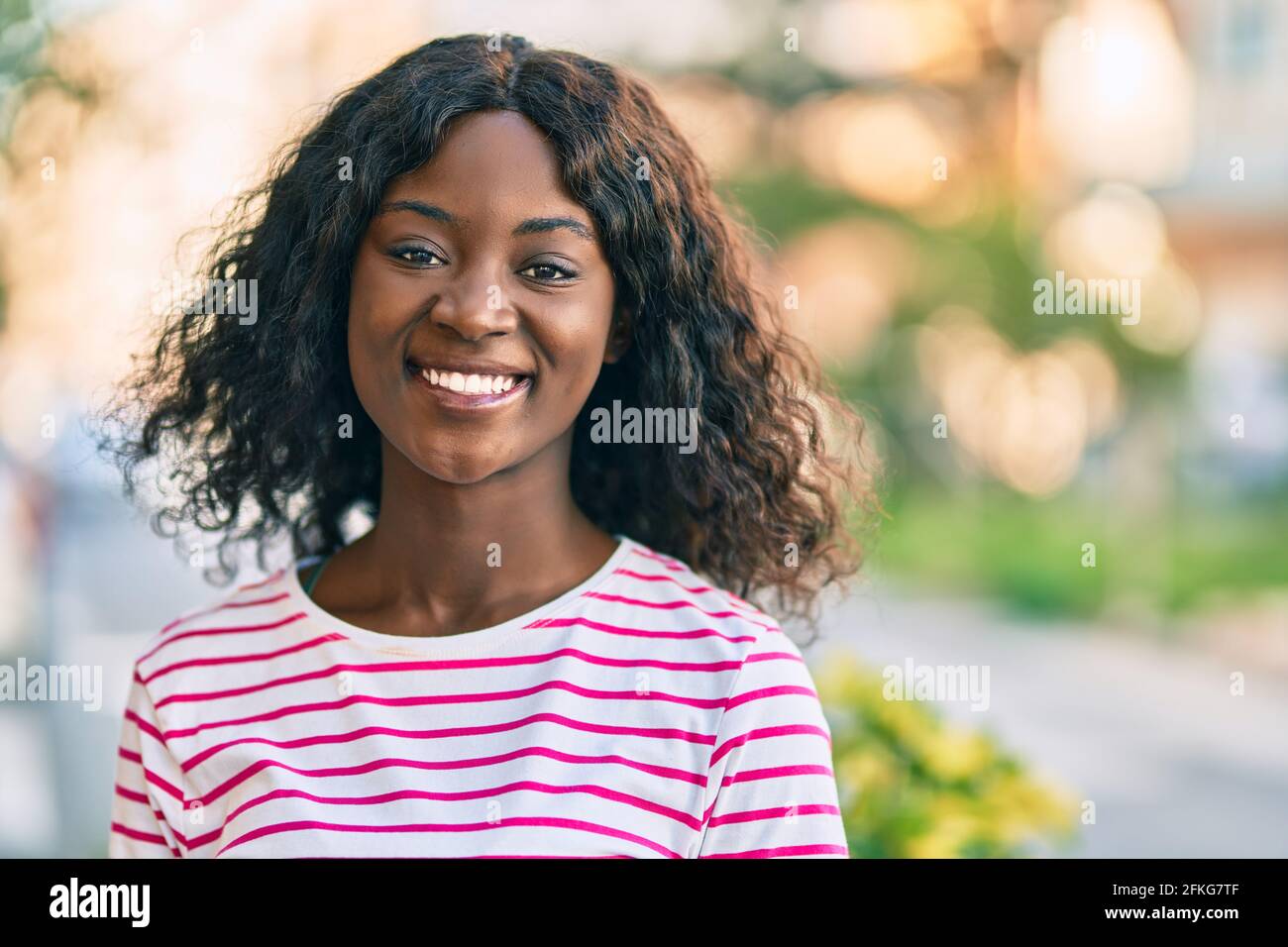 Young african american girl smiling happy standing at the city Stock ...