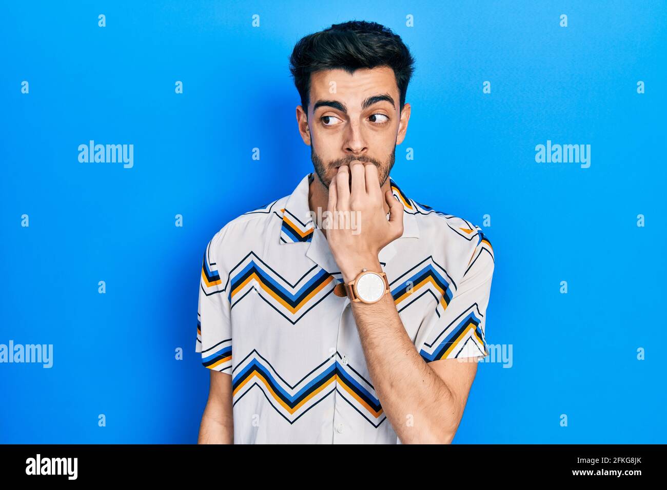 Young hispanic man wearing casual clothes looking stressed and nervous ...