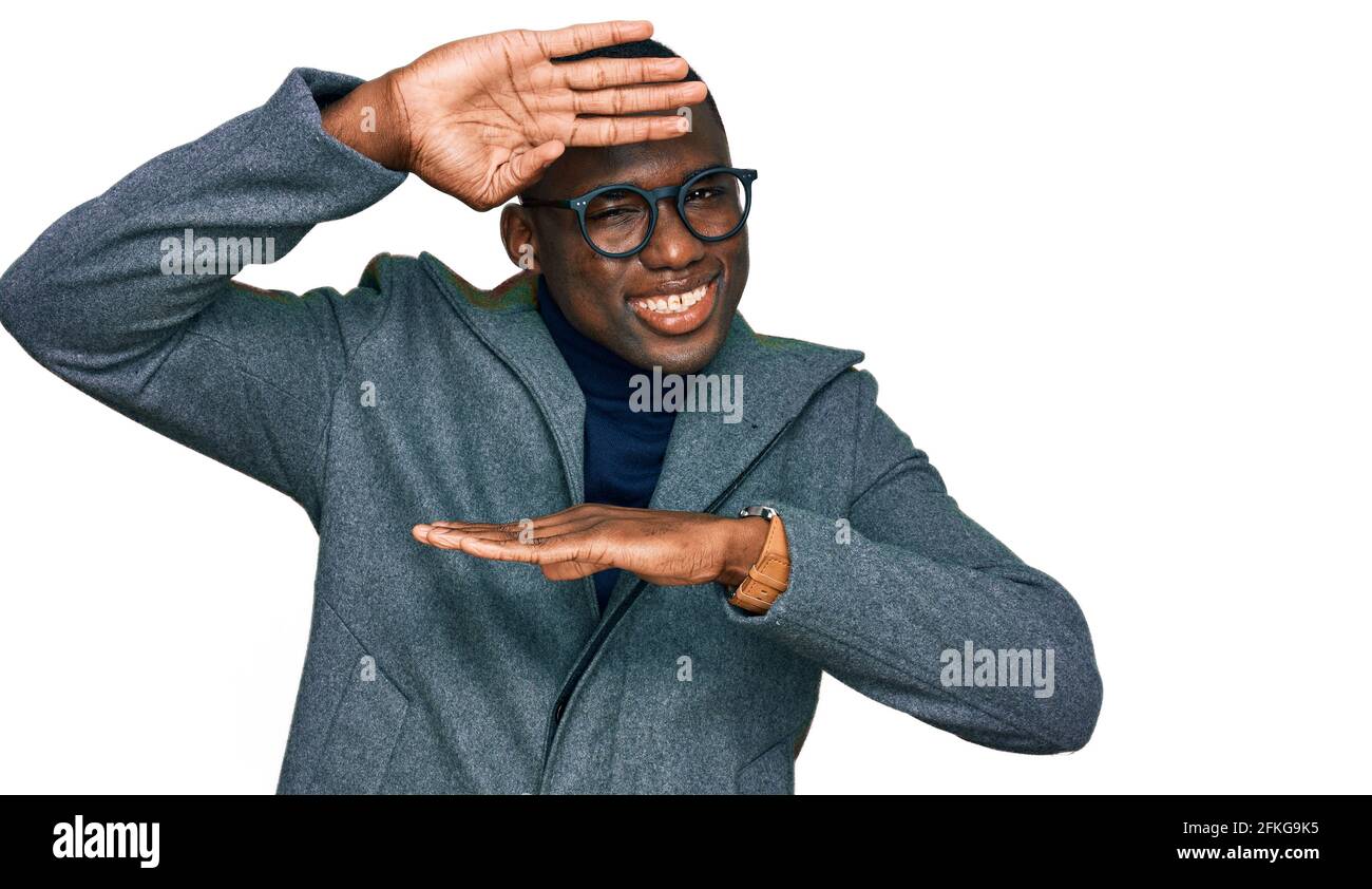 Young african american man wearing business clothes and glasses smiling ...