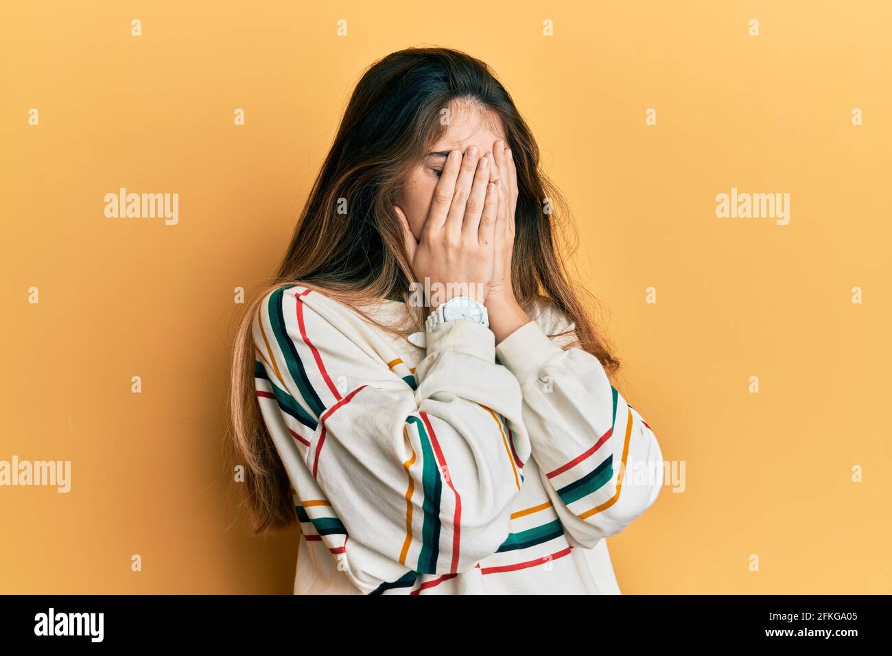 Young caucasian woman wearing casual clothes with sad expression ...