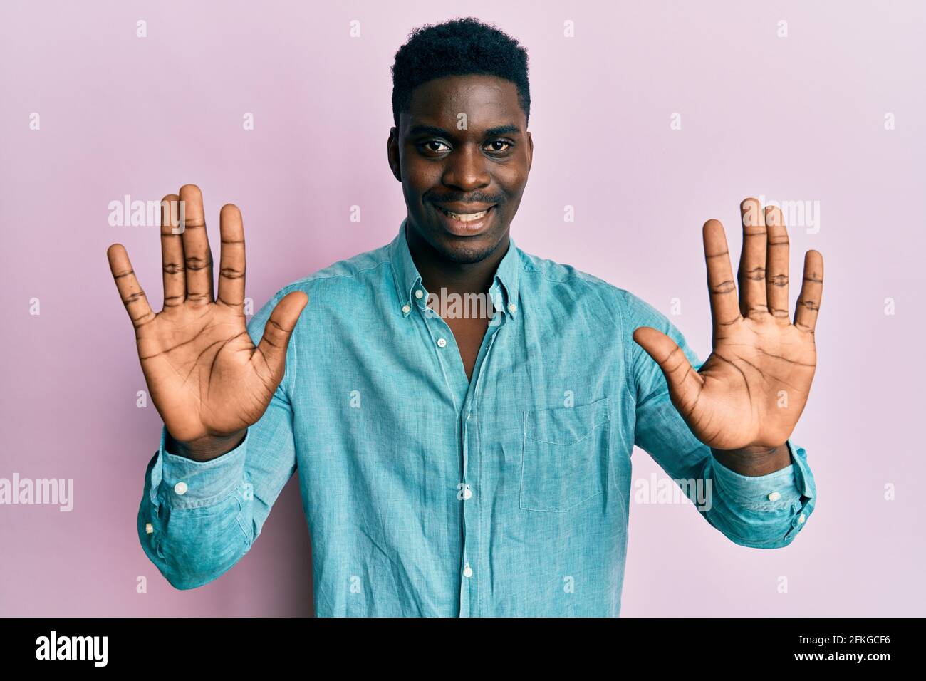 Handsome black man wearing casual clothes showing and pointing up with ...