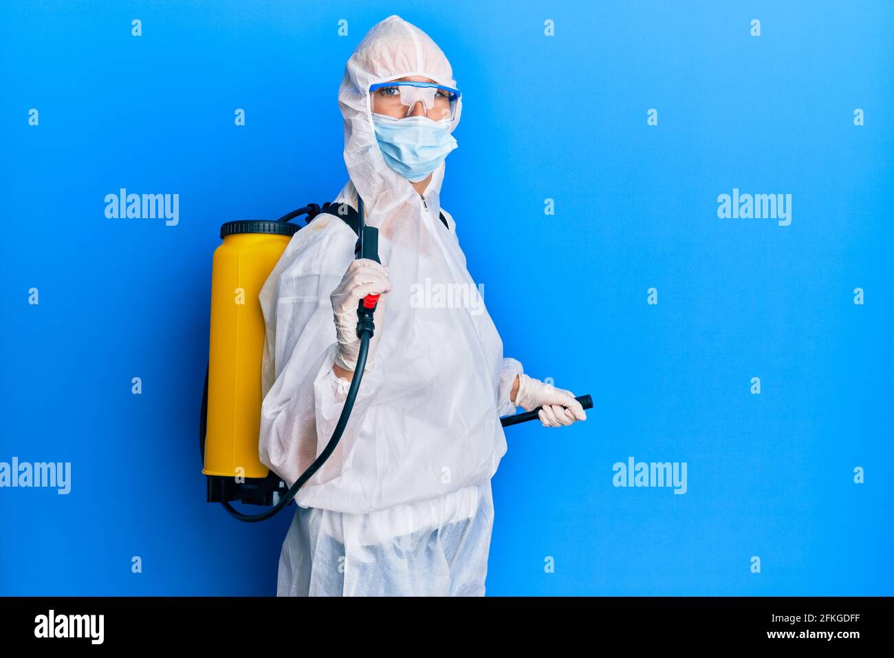 Covid specialist wearing decontamination protective suit and ...